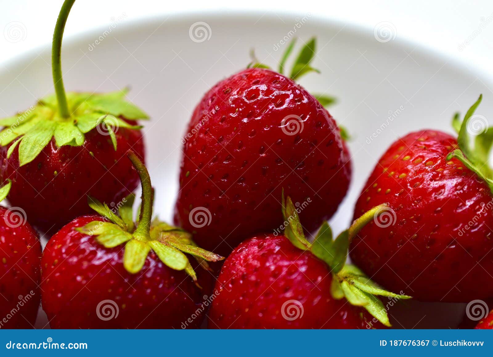 Large Delicious Victoria Berries and Sliced Victoria Berries on a White ...