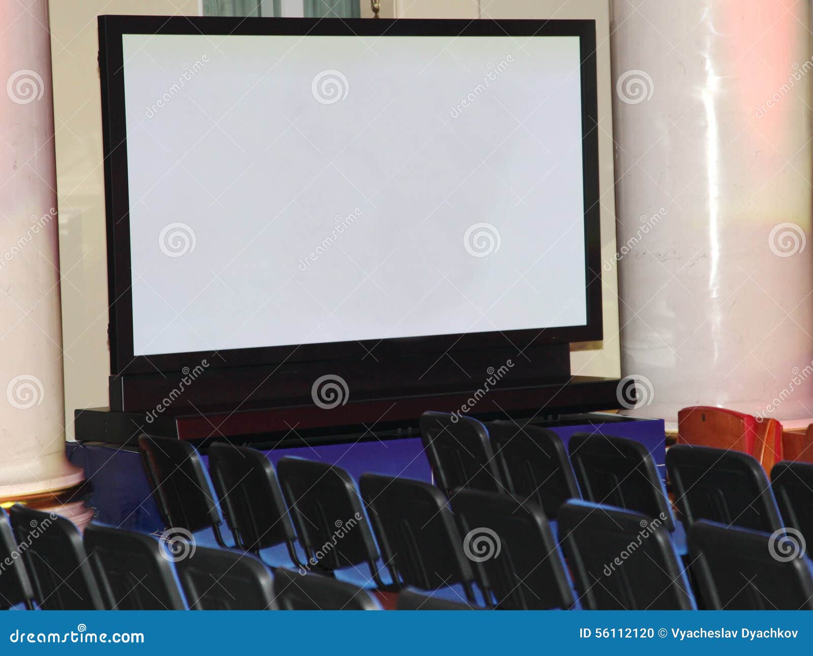 A Large Demonstration Plasma Screen and Rows of Seats for Spectators ...