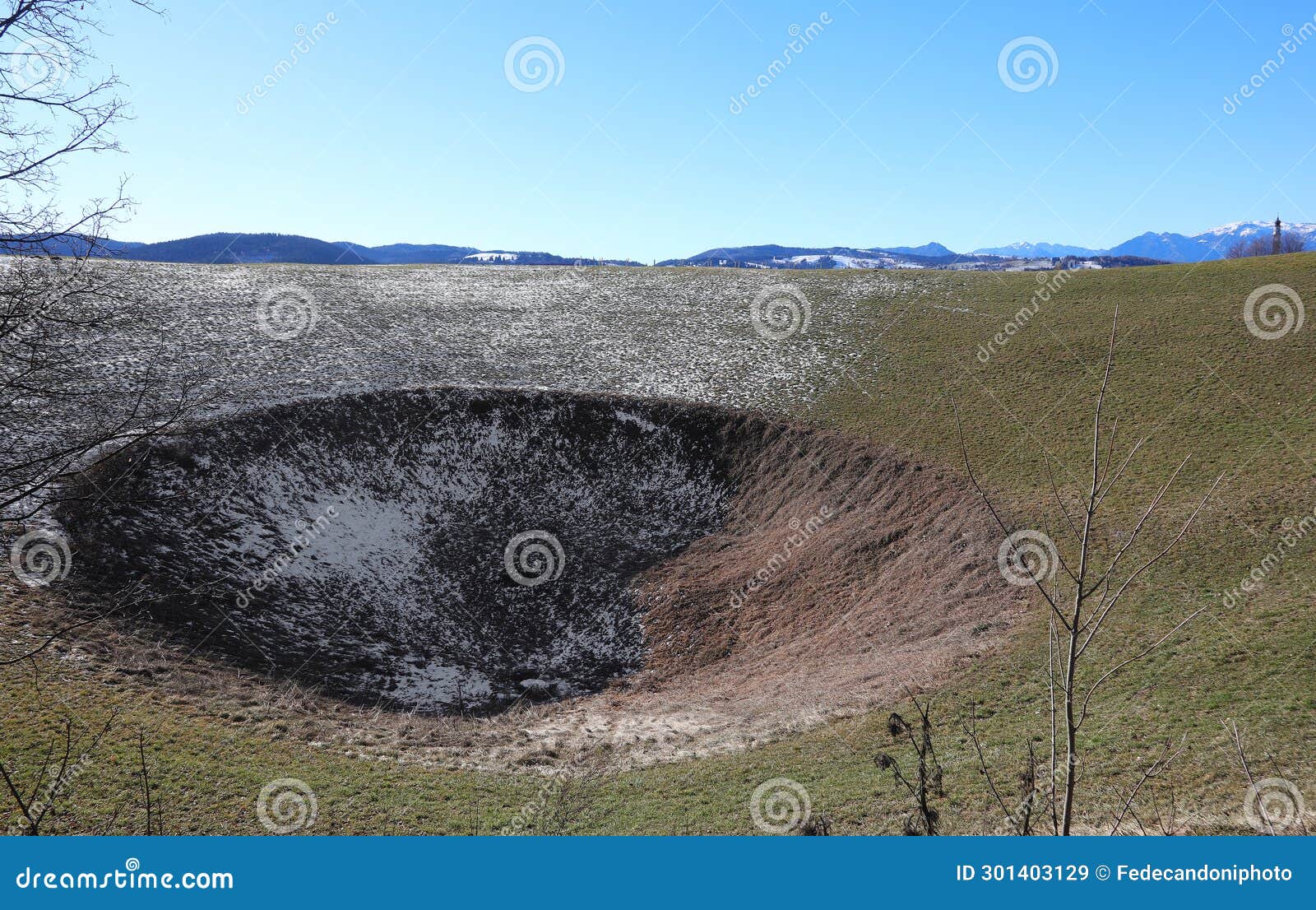 Large Depression in the Terrain with Snow in the Mountains Caused by ...