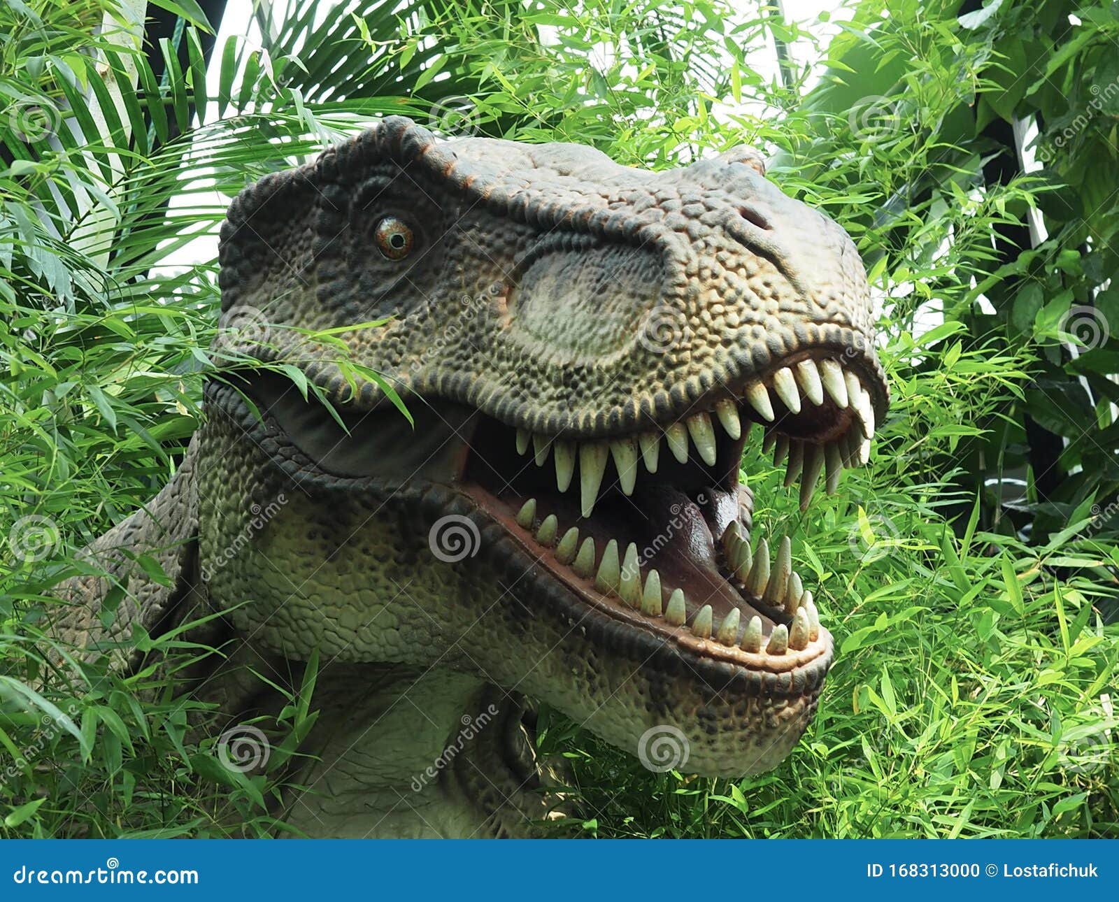 Large Dinosaur Model Surrounded by Vegetation Editorial Image - Image ...