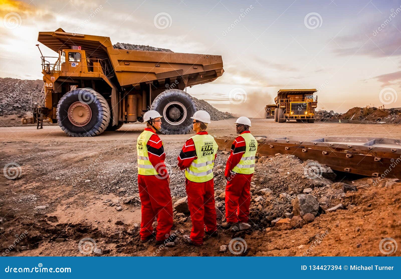 Large Dump Trucks Transporting Platinum Ore for Processing with Mining ...
