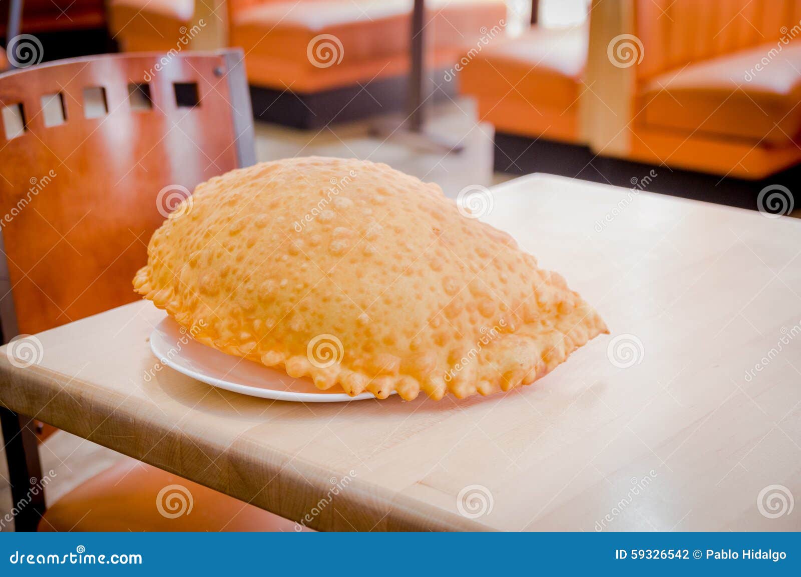 Large Empanada Sitting on Small White Plate Stock Photo - Image of ...