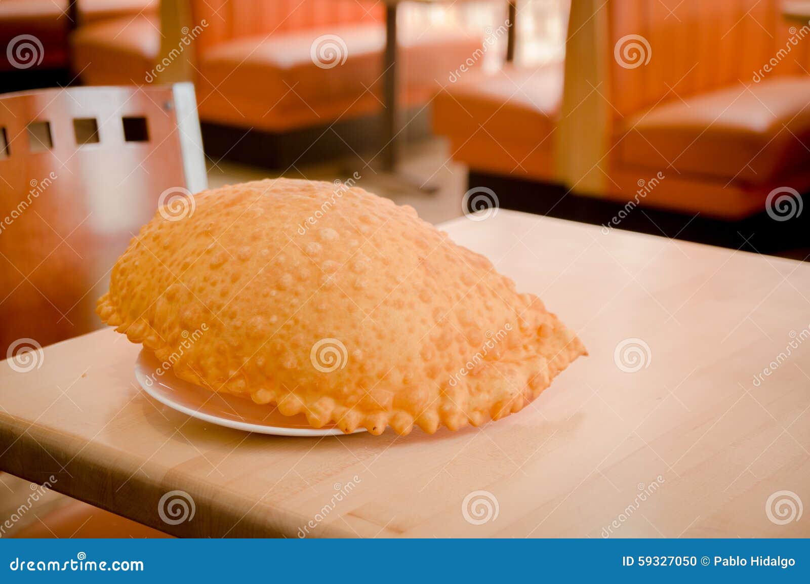 Large Empanada Sitting on Small White Plate Stock Photo - Image of ...