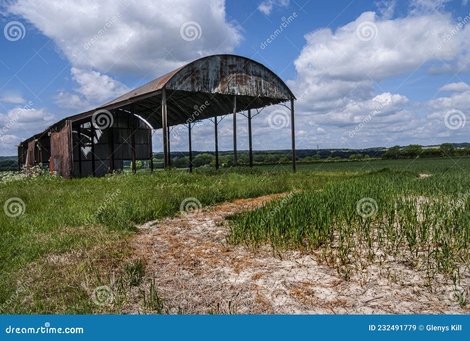 A Large Empty Dilapidated Barn Stock Image - Image of farmland, green ...
