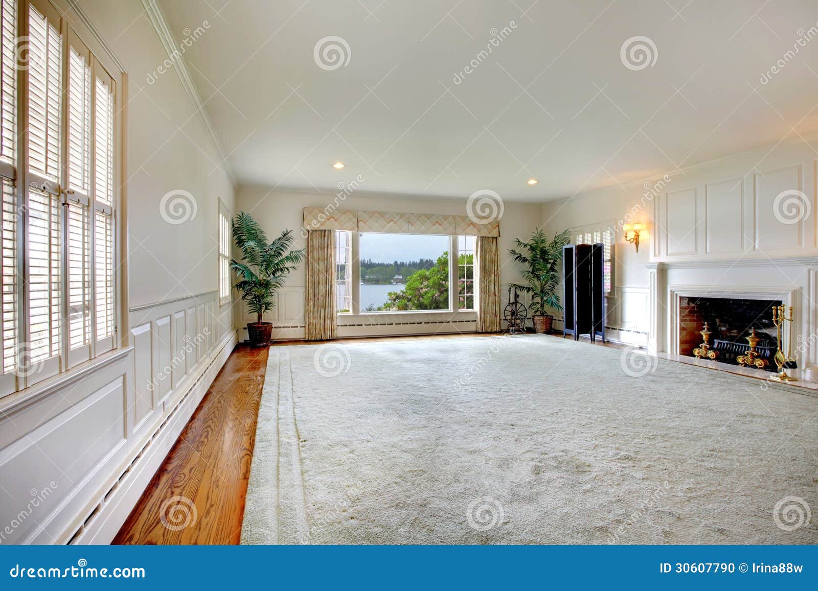 Large Living Room With Many Windows Facing The Street With Gray ...