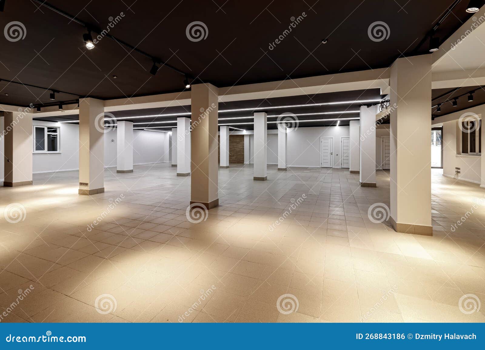 A Large Empty Room with Ceramic Tiles on the Floor, a Black Ceiling ...