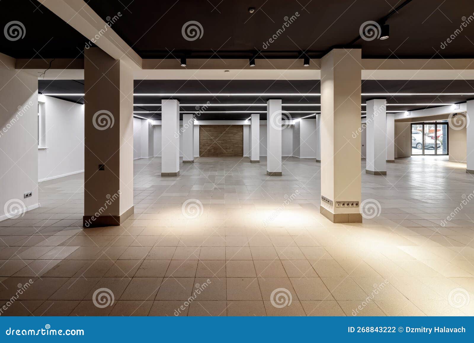 A Large Empty Room with Ceramic Tiles on the Floor, a Black Ceiling ...
