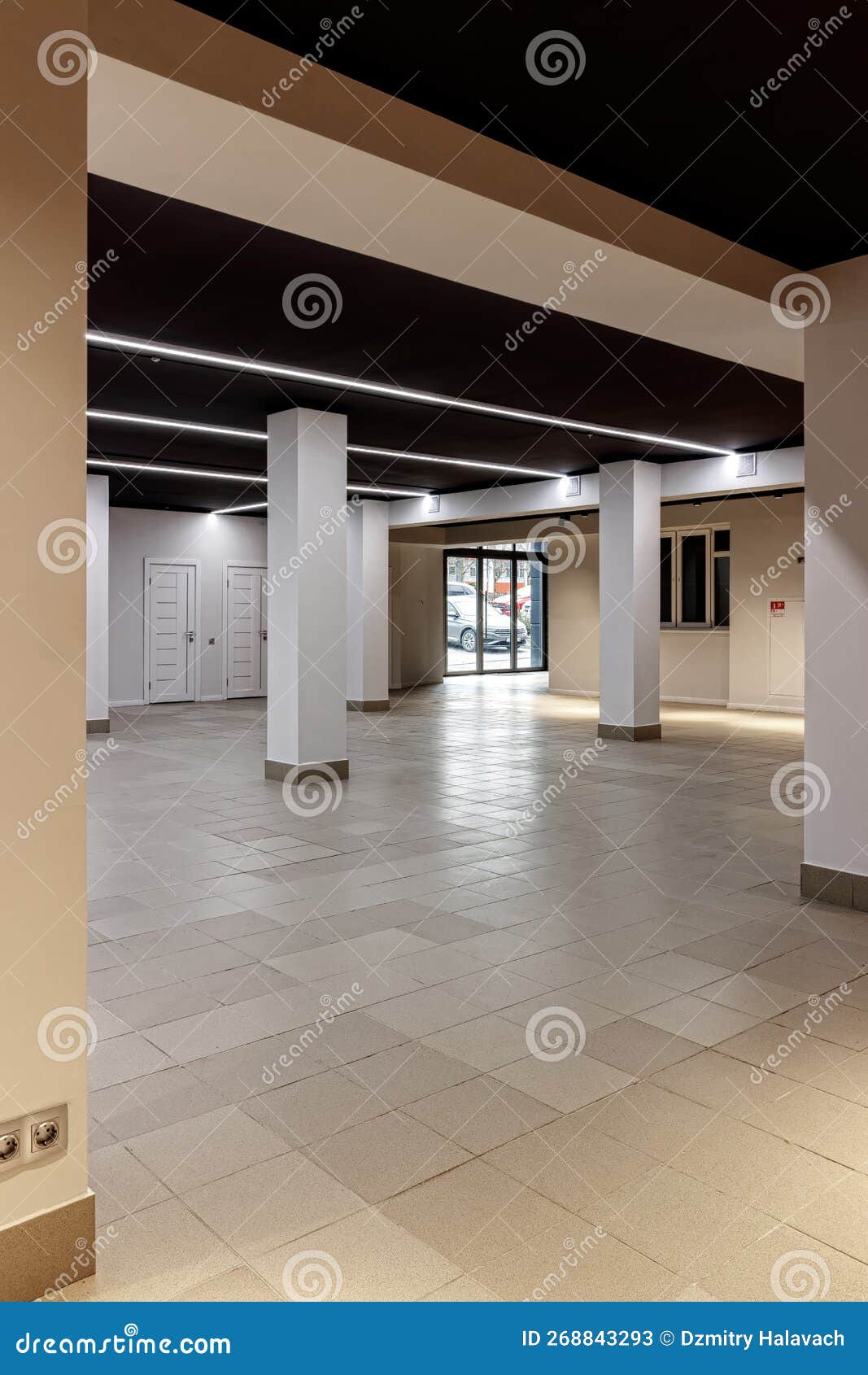 A Large Empty Room with Ceramic Tiles on the Floor, a Black Ceiling ...