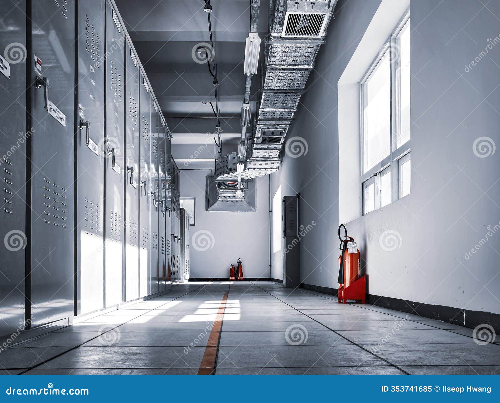 A Large Electric Room with a Red Fire Extinguisher on the Floor Stock ...
