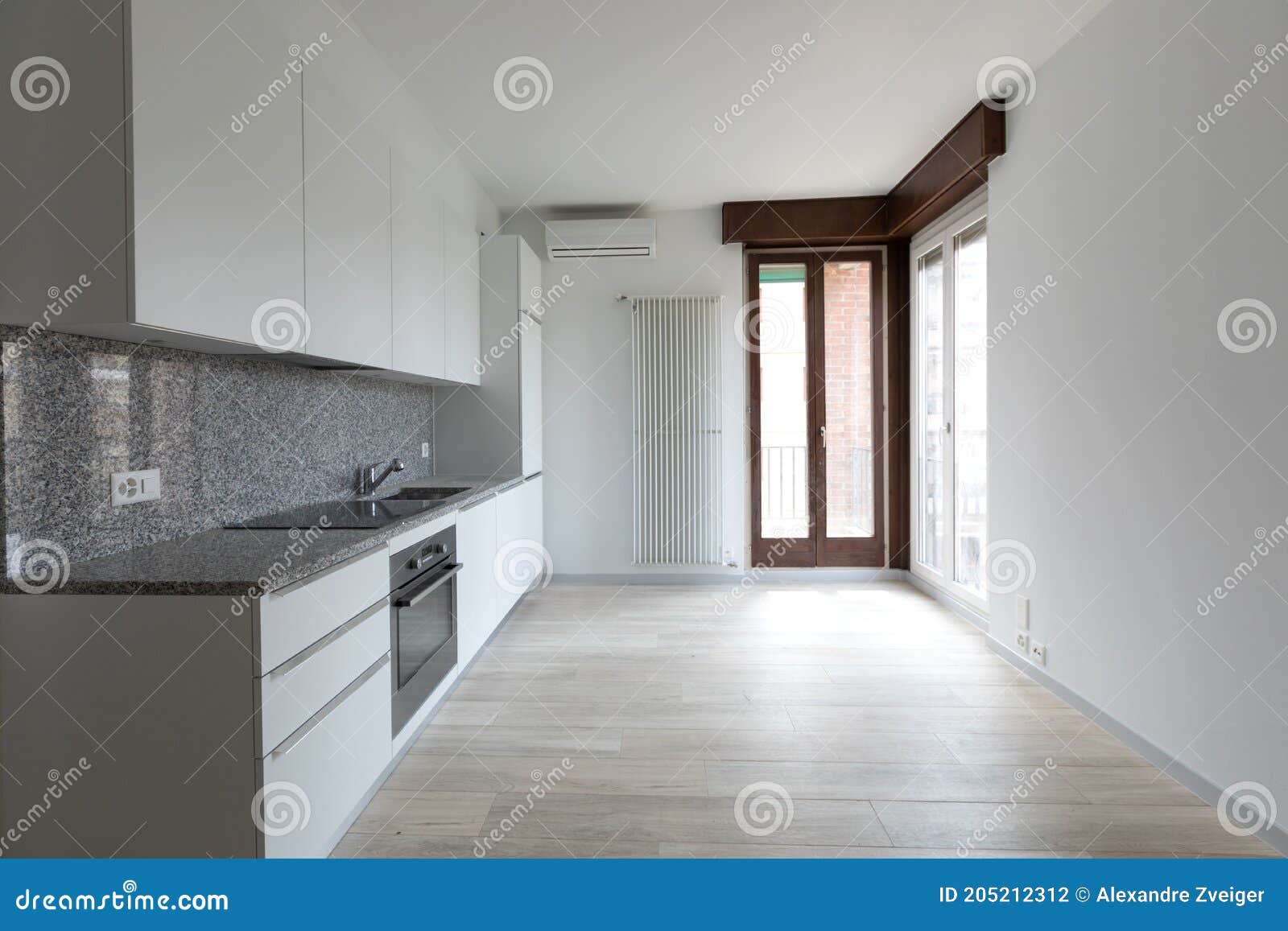 Large Empty Room with White Walls and Modern Kitchen Stock Photo ...