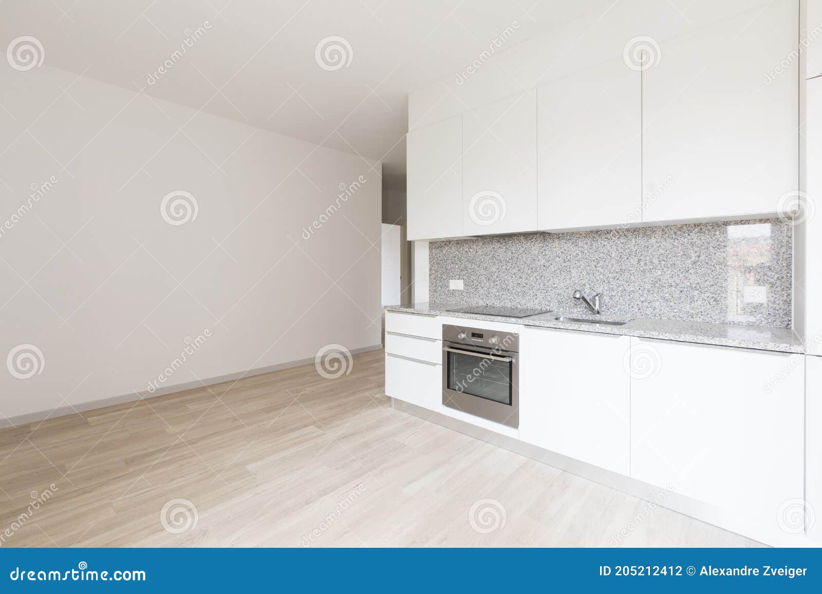 Large Empty Room with White Walls and Modern Kitchen Stock Photo ...
