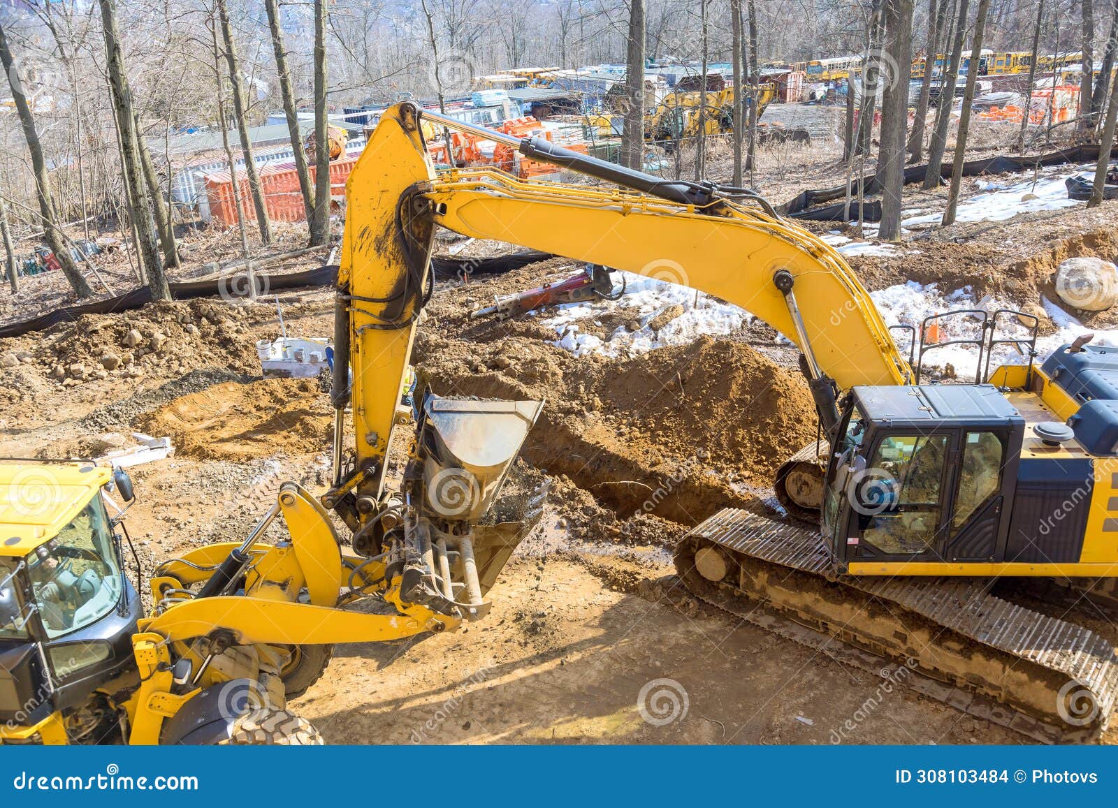 A Large Excavator is Digging on an Industrial Site for Development of ...