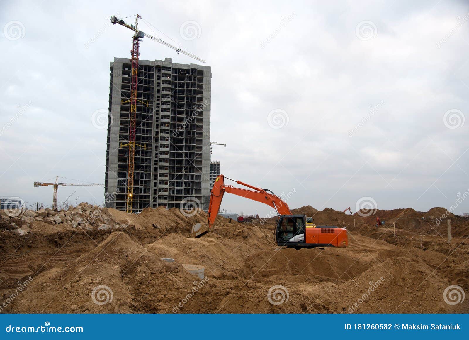 Large Excavator Working at Construction Site. Backhoe during Earthworks ...