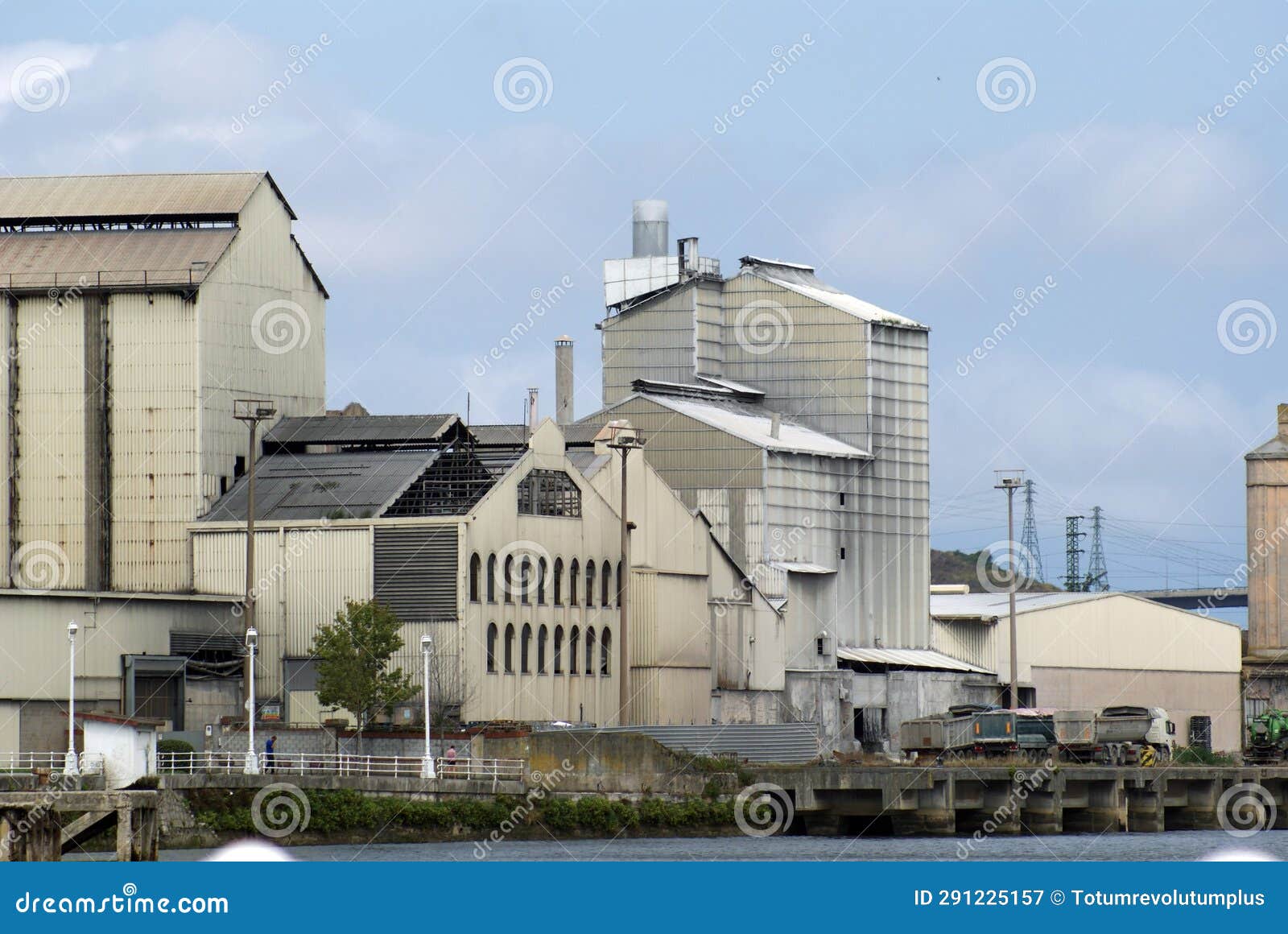Large Factory with Blue Sky in the Background Stock Image - Image of ...
