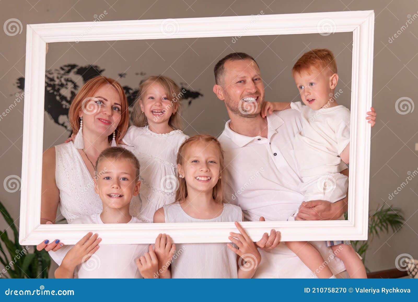 Large Family Holding Picture Frame Stock Photo - Image of happiness ...