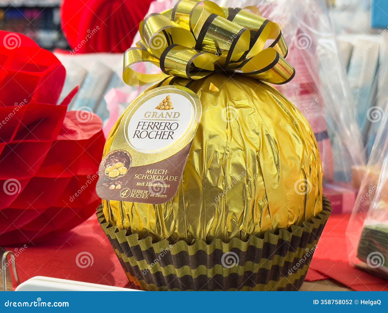 Large Ferrero Rocher Chocolate Wrapped in Gold Foil with Decorative Bow ...