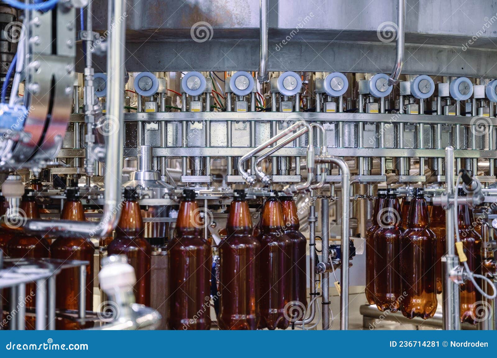 Large Filling Machine, the Process of Filling Plastic Bottles with ...