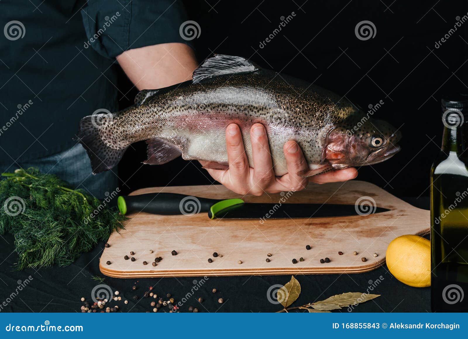 Large Fresh Fish in the Kitchen in the Hands of the Chef Stock Image ...