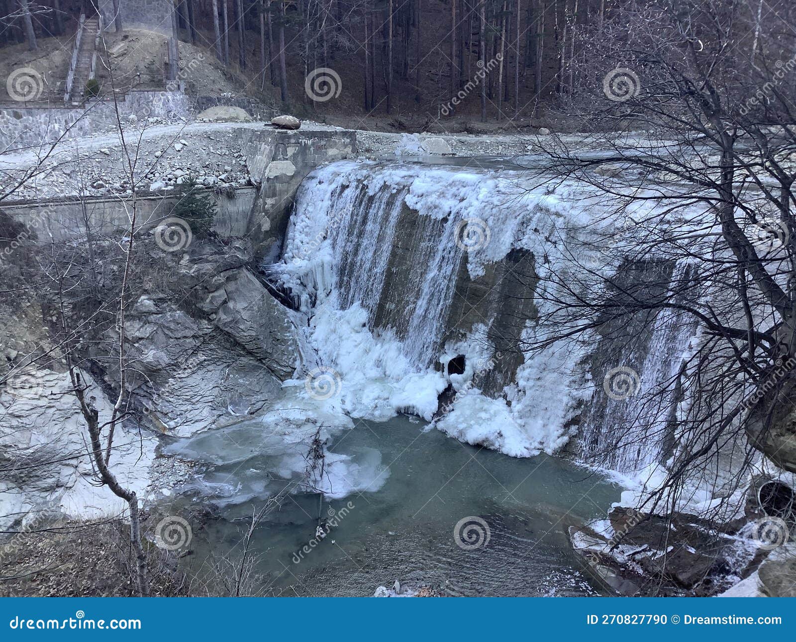 The Big Frozen Waterfall at the Beginning of Spring Stock Photo - Image ...