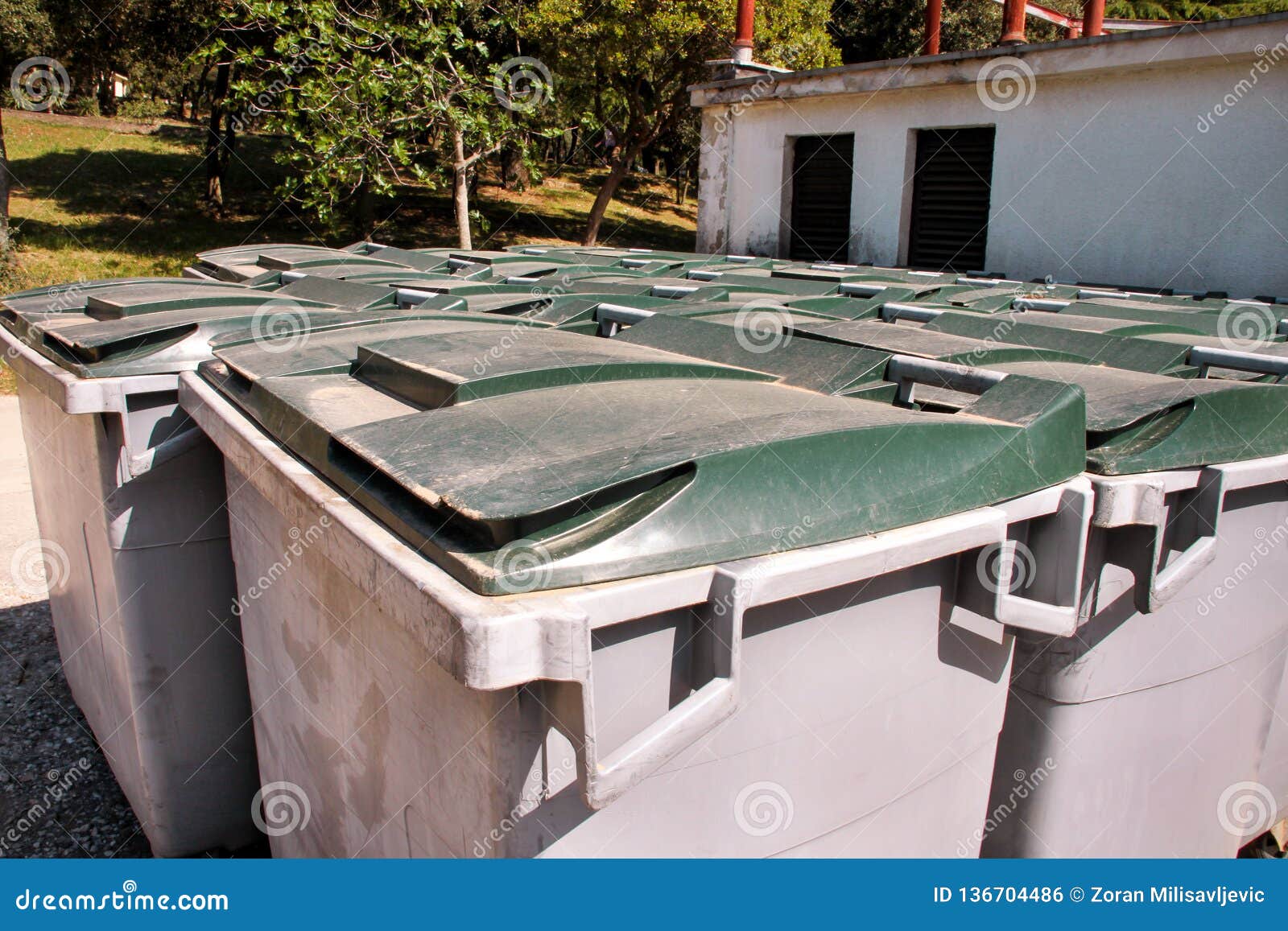 Large Garbage Containers, Trash Dumpsters and Bins Standing in Row ...