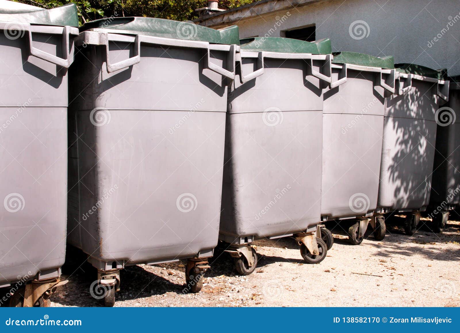 Large Garbage Containers, Trash Dumpsters and Bins Standing in Row ...