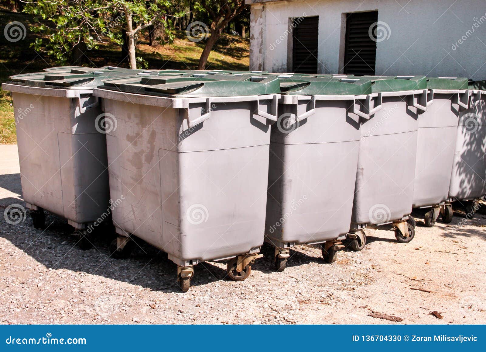 Large Garbage Containers, Trash Dumpsters and Bins Standing in Row ...