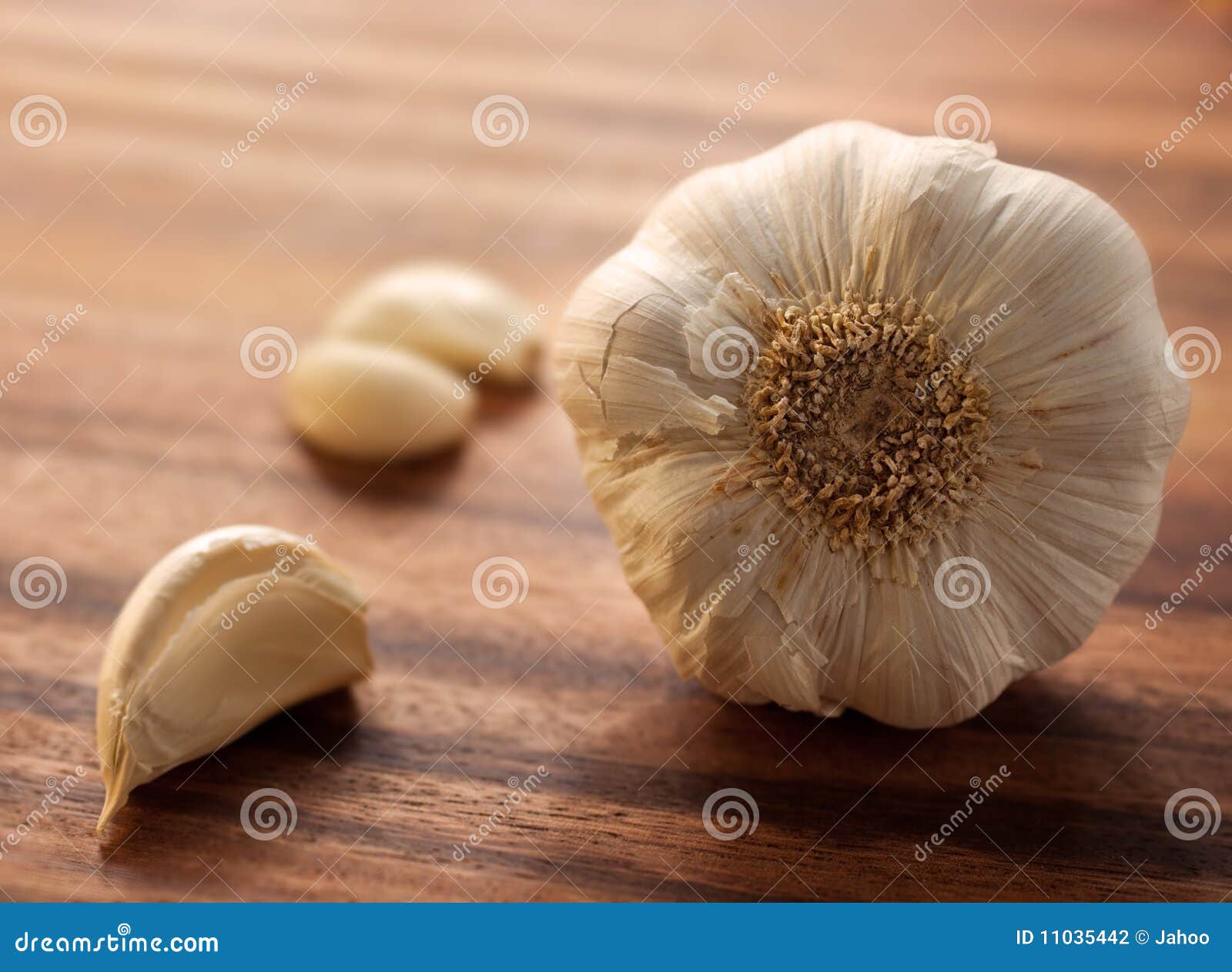Large Garlic Head with a Couple of Peeled Cloves Stock Photo - Image of ...