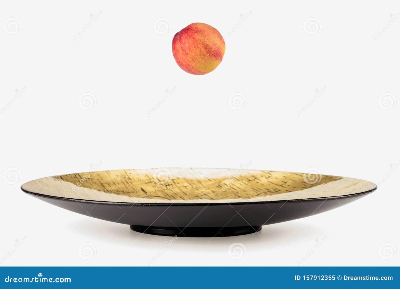 Large Gilded Inside Dish is Isolated on a White Background with a Ripe ...