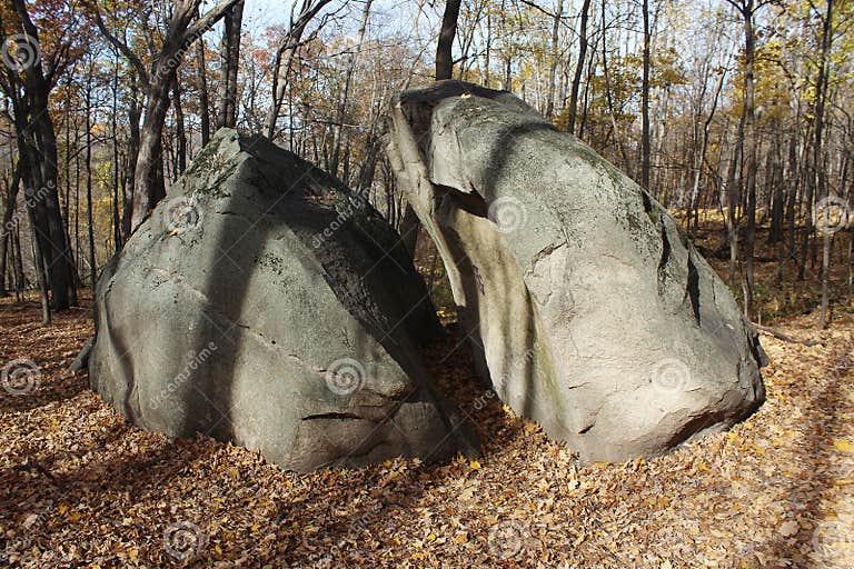 A Large Granite Rock Split in Half Stock Photo - Image of meadow, rests ...