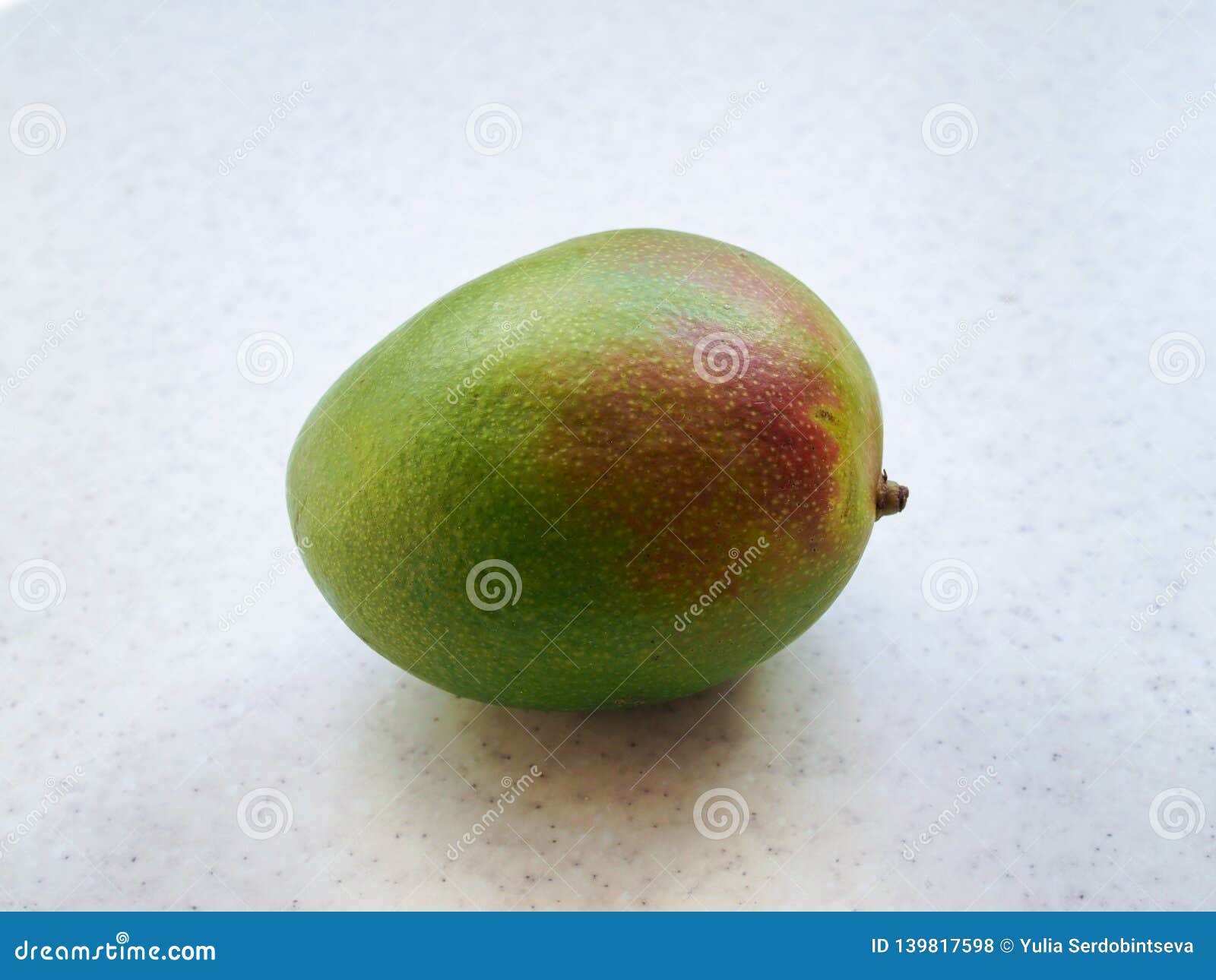 A Large Green and Red Mango is on the Table Stock Photo - Image of ...