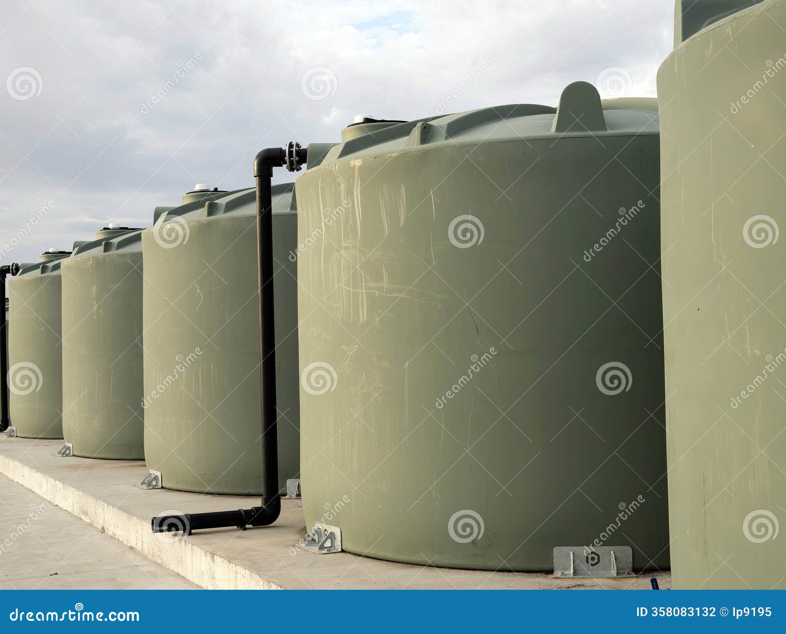 Large Green Water Storage Tanks and Overflow Piping Stock Photo - Image ...