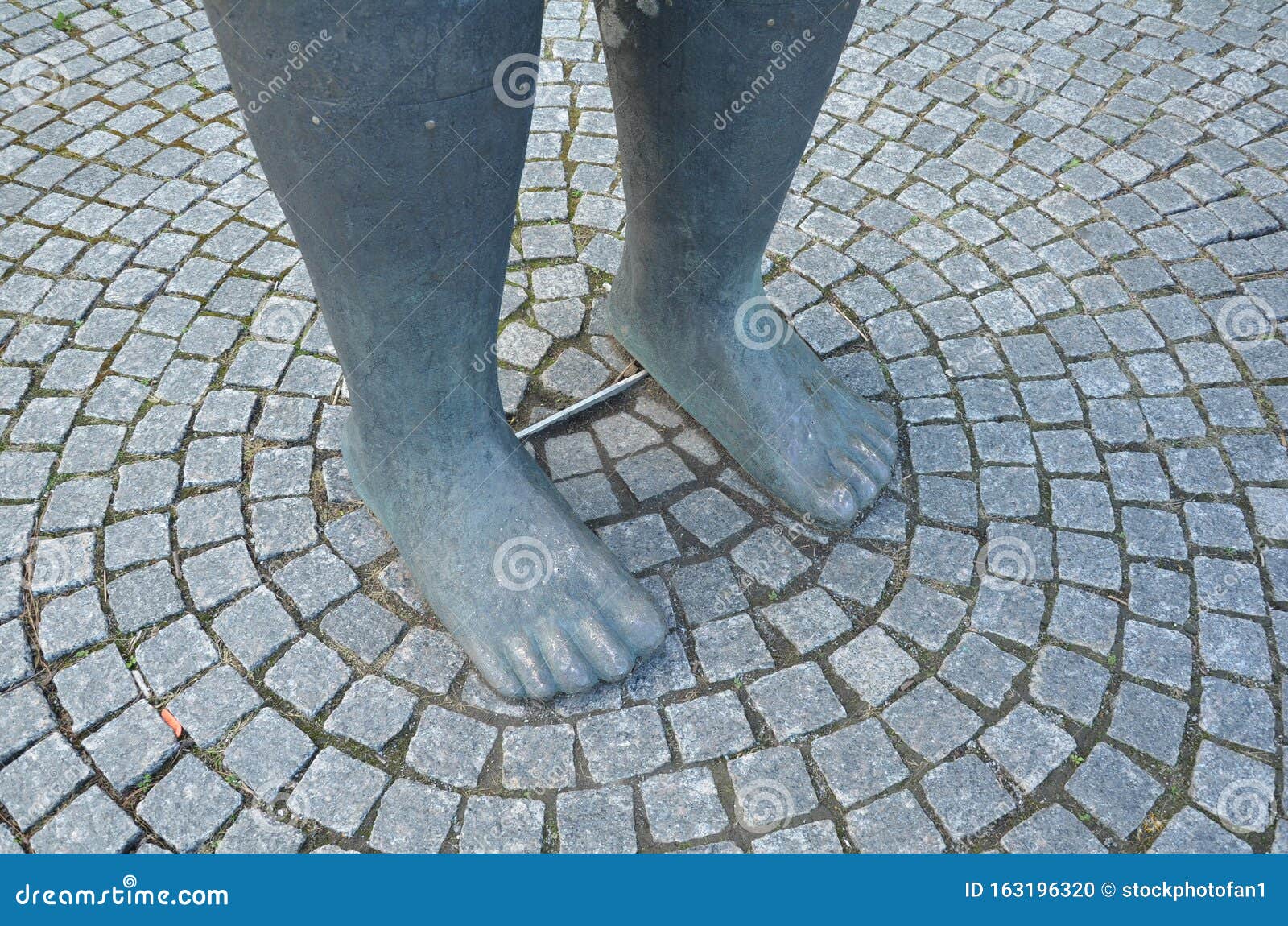 Large Grey Feet of Statue with Cobblestone Ground Stock Photo - Image ...