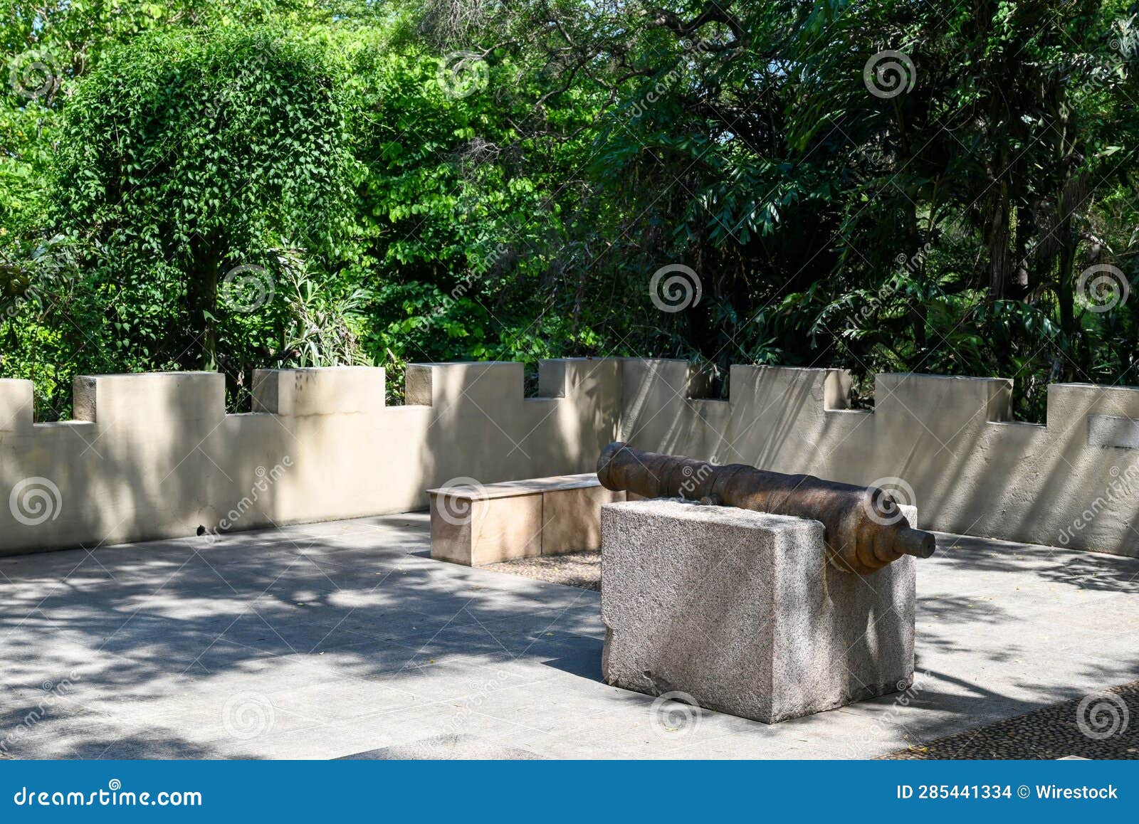 Large Grey Stone Bench Situated in a Shaded Area Next To a Brick Wall ...