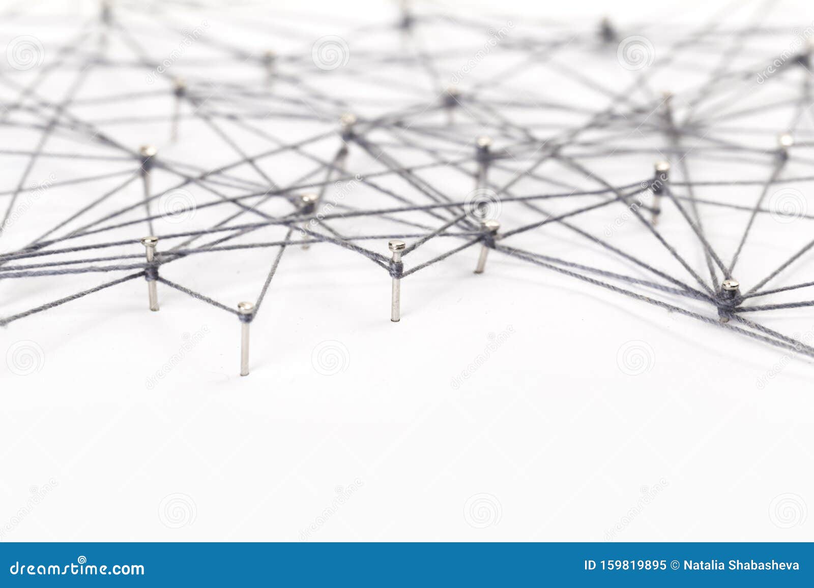 A Large Grid of Pins Connected with String. Communication, NetwA Large ...
