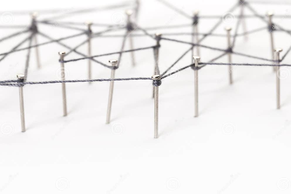 A Large Grid of Pins Connected with String. Communication, NetwA Large ...