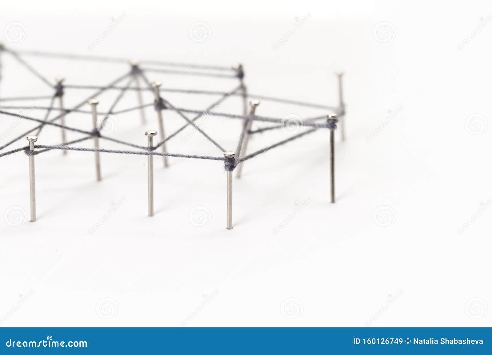 A Large Grid of Pins Connected with String. Communication, NetwA Large ...