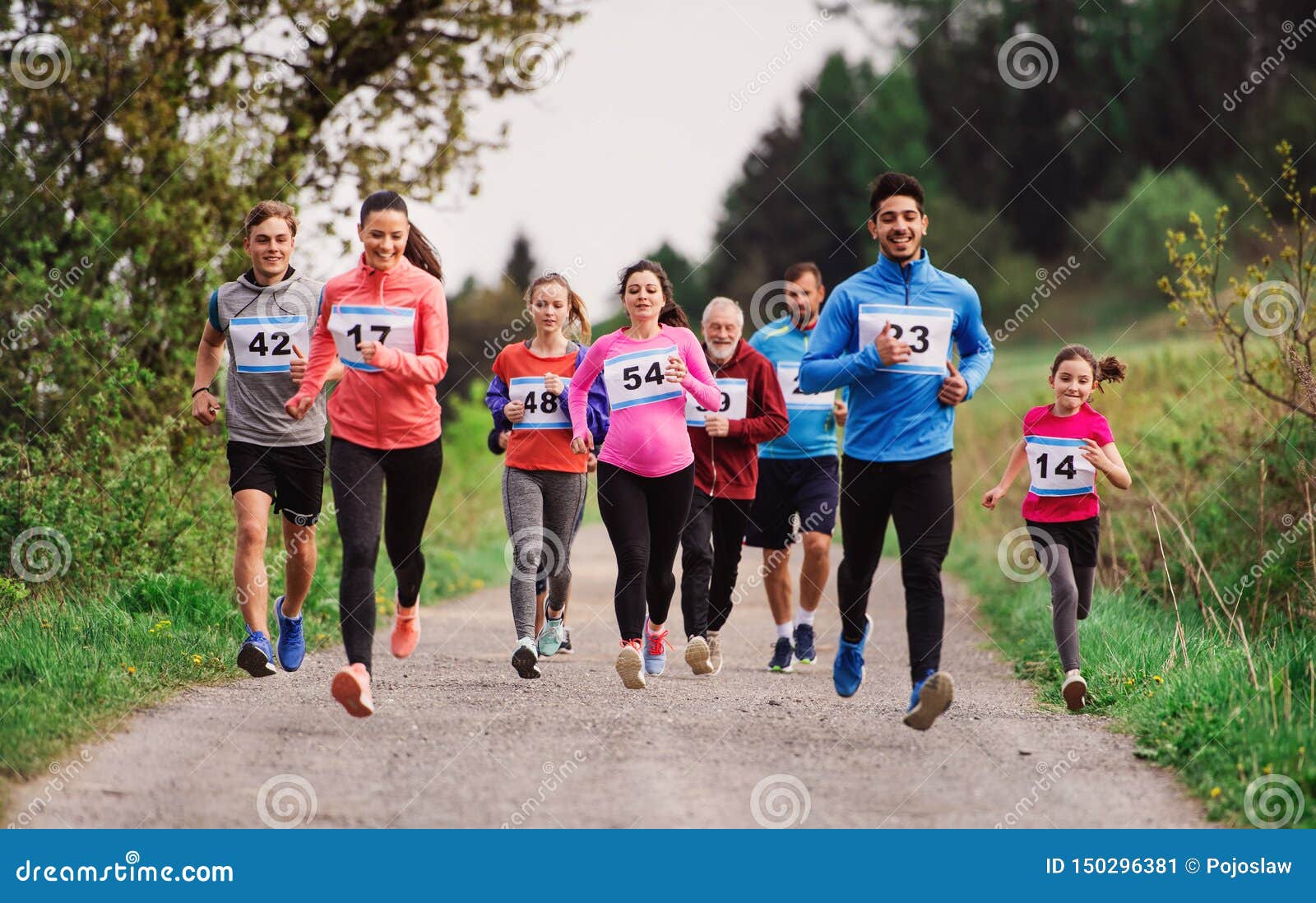 Large Group of Multi Generation People Running a Race Competition in ...