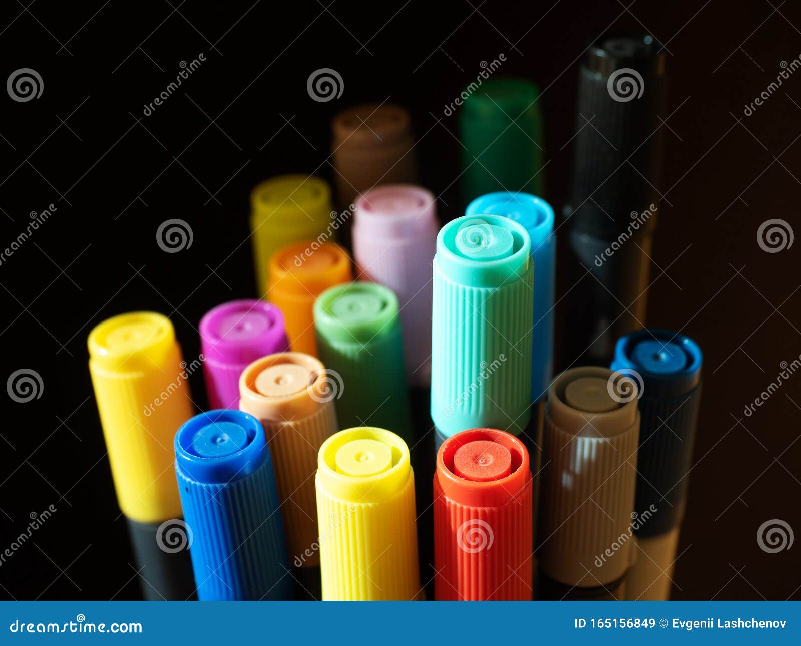 Large Group of Colored Felt-tip Pens with Caps on a Dark Background ...