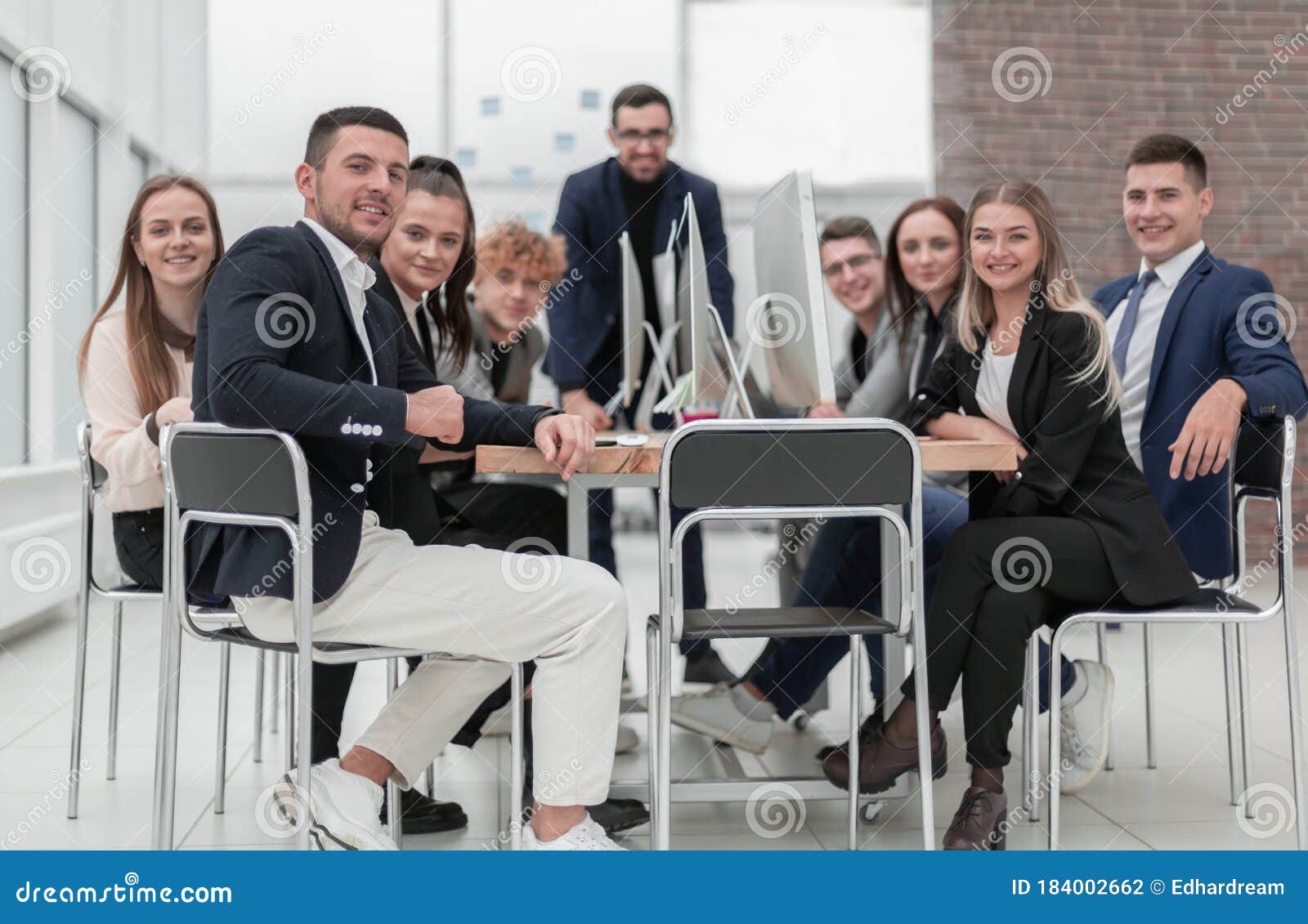 Large Group of Employees Sitting at Office Desk. Stock Photo - Image of ...
