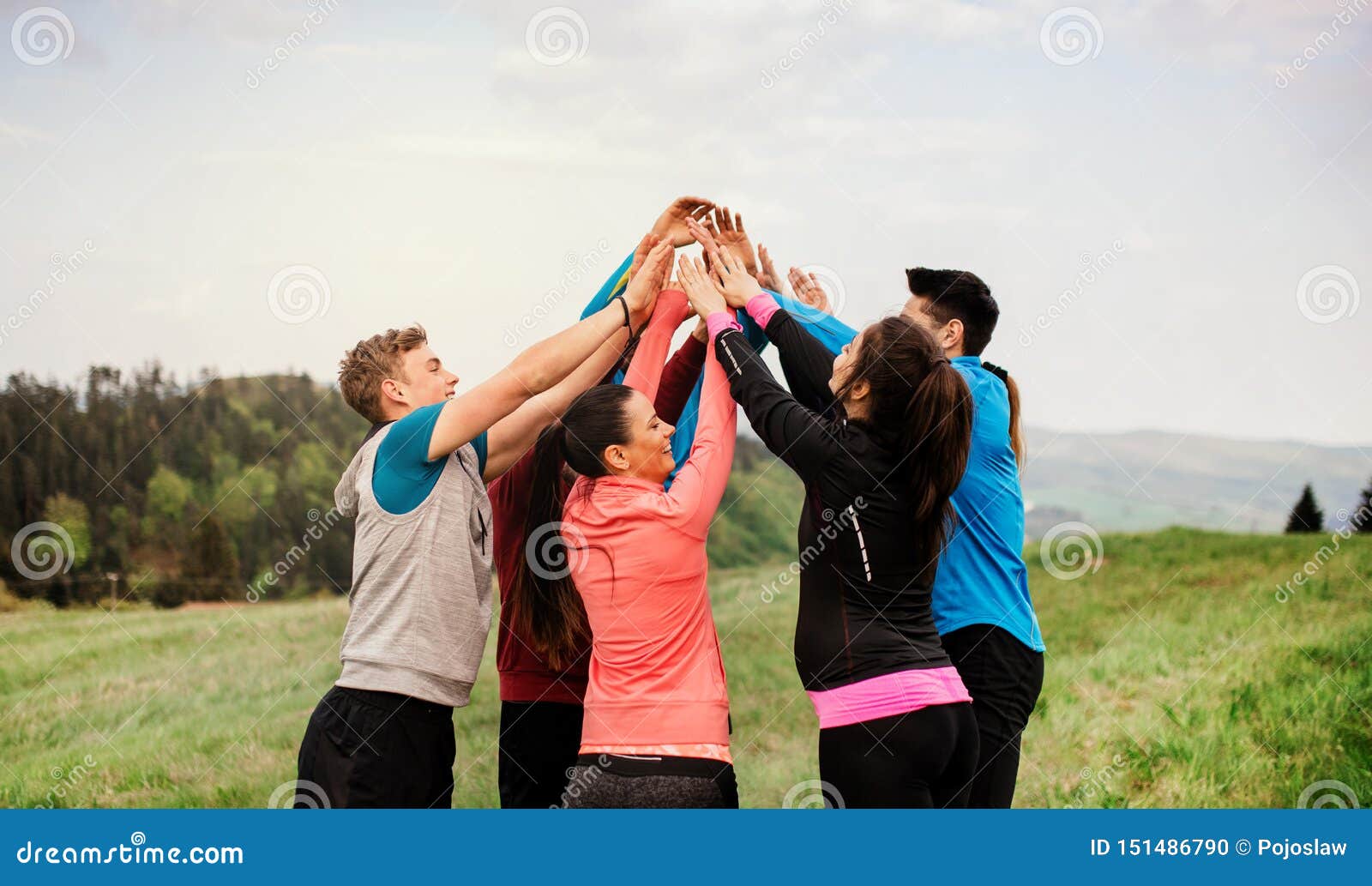 Large Group of Fit and Active People Resting after Doing Exercise in ...