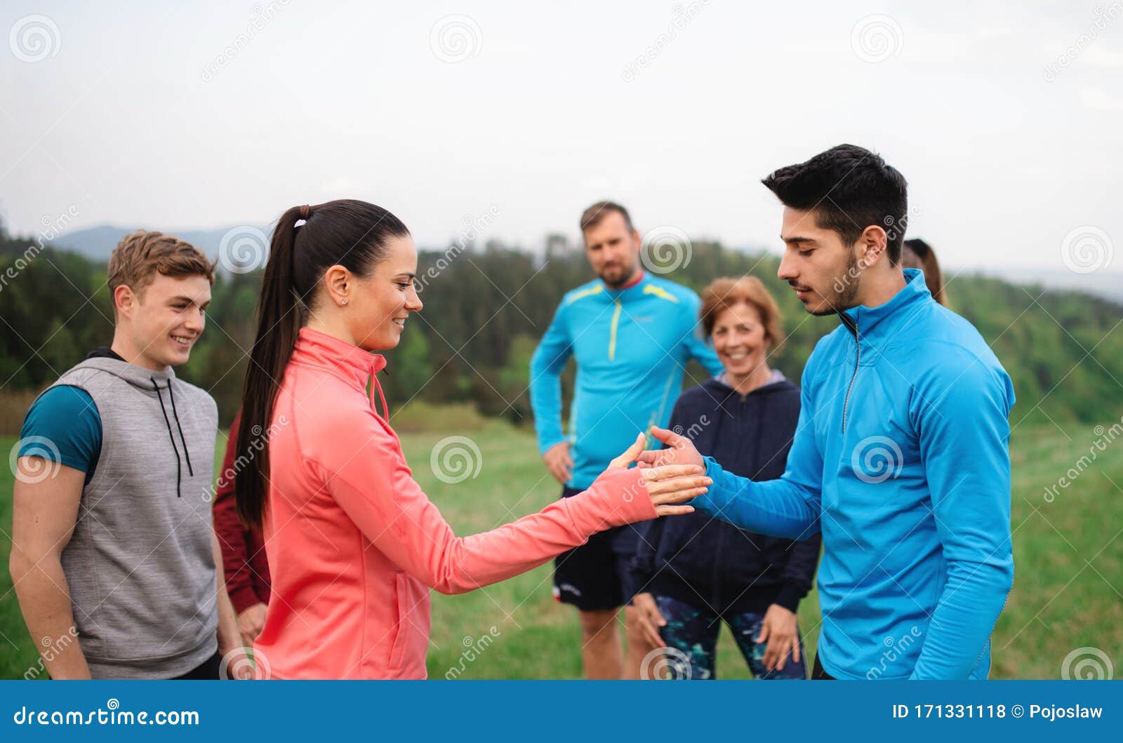 Large Group of Fit and Active People Resting after Doing Exercise in ...