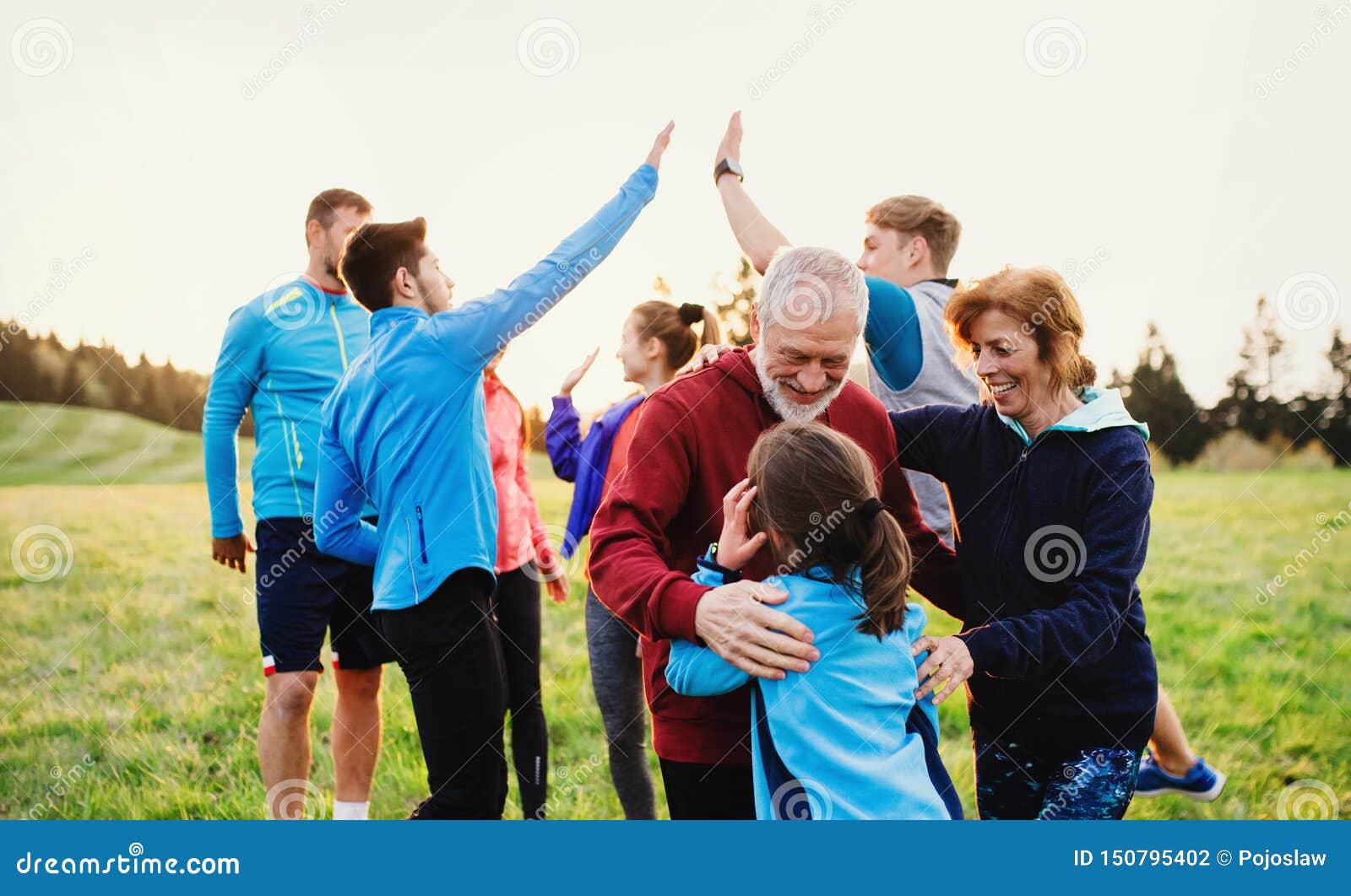 Large Group of Fit and Active People Resting after Doing Exercise in ...