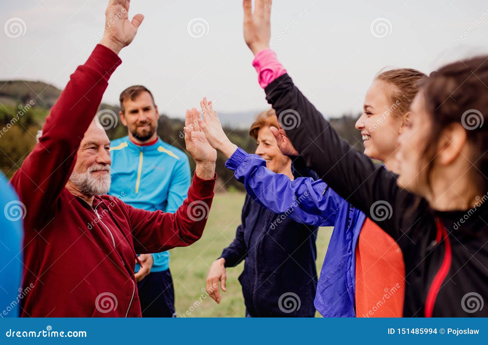 Large Group of Fit and Active People Resting after Doing Exercise in ...