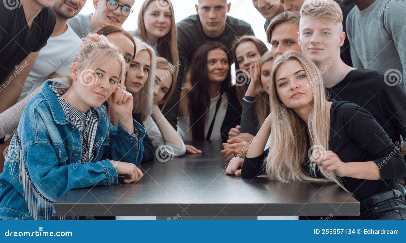 Large Group of Friends Sitting at a Table Stock Photo - Image of team ...