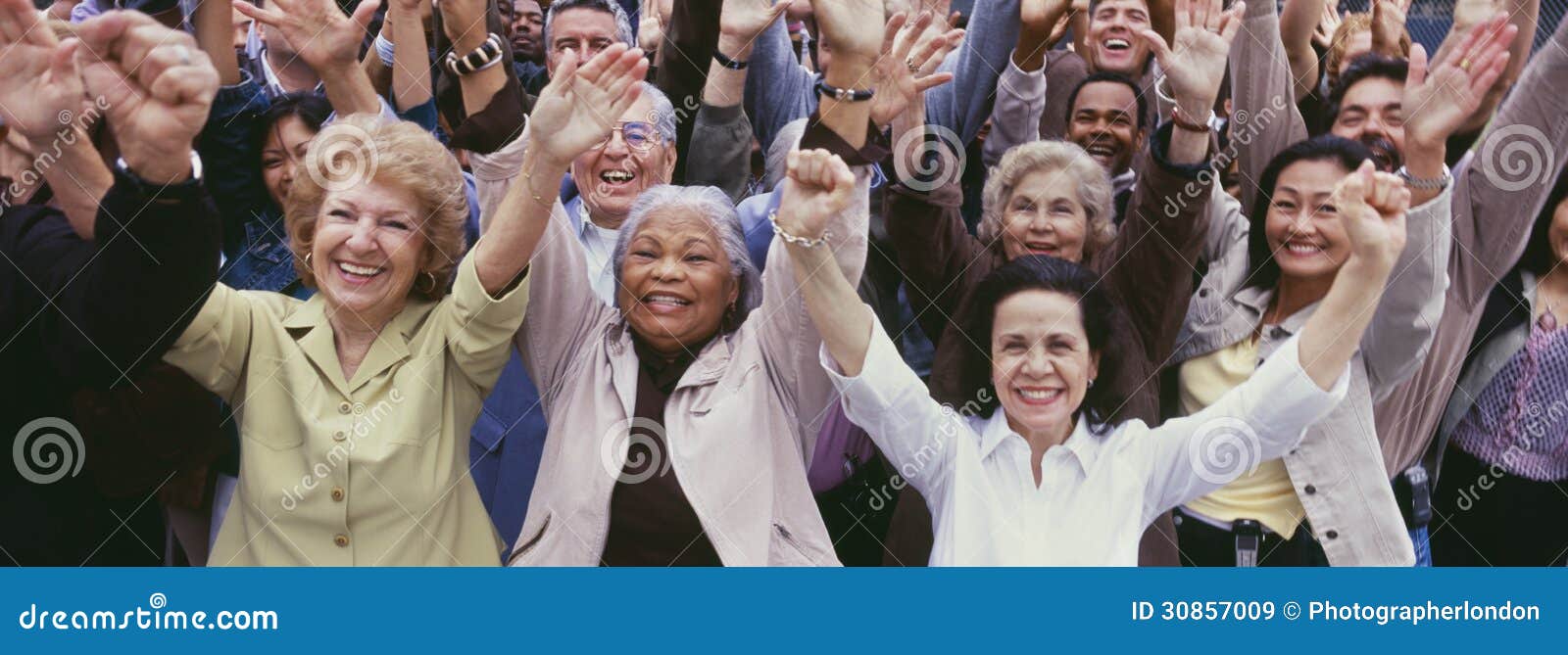 Large Group of Multi-ethnic People Cheering with Arms Raised Stock ...