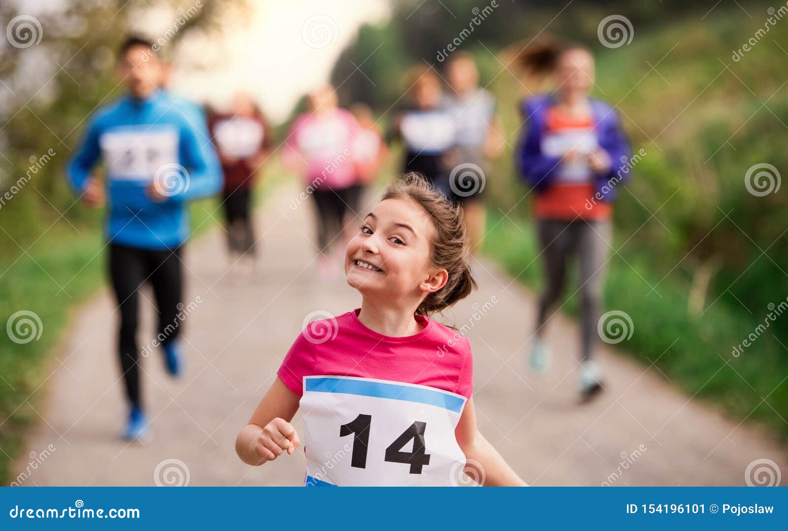 Large Group of Multi Generation People Running a Race Competition in ...