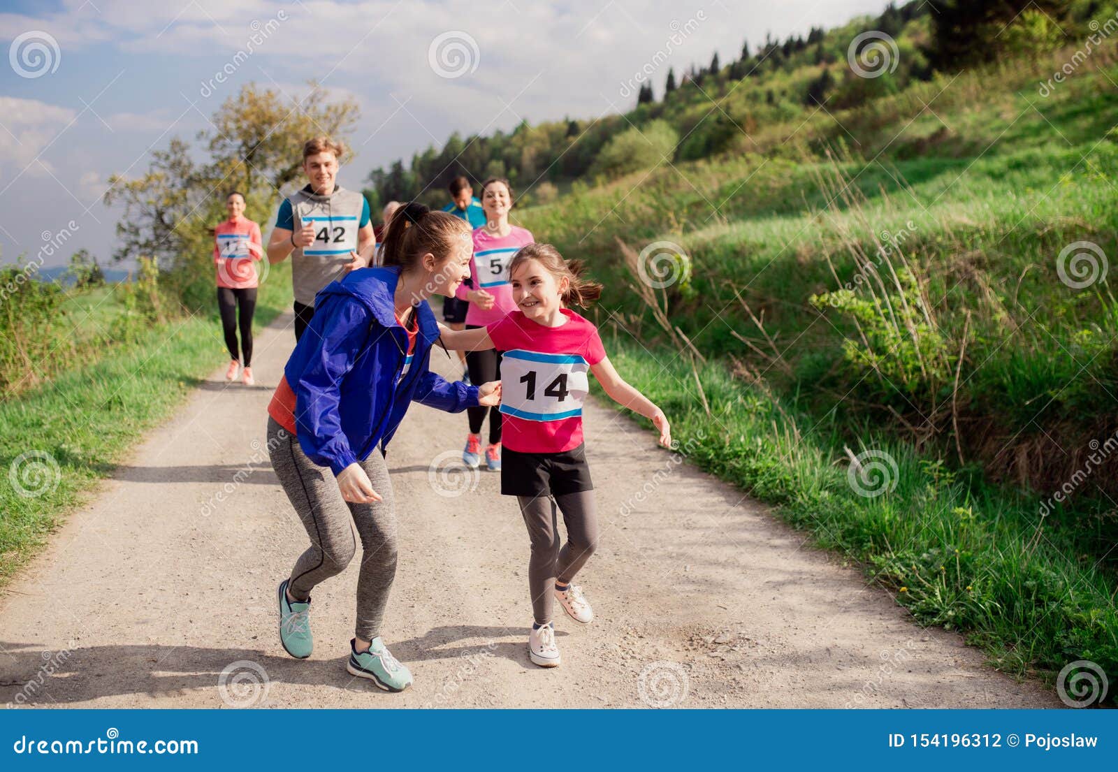 Large Group of Multi Generation People Running a Race Competition in ...