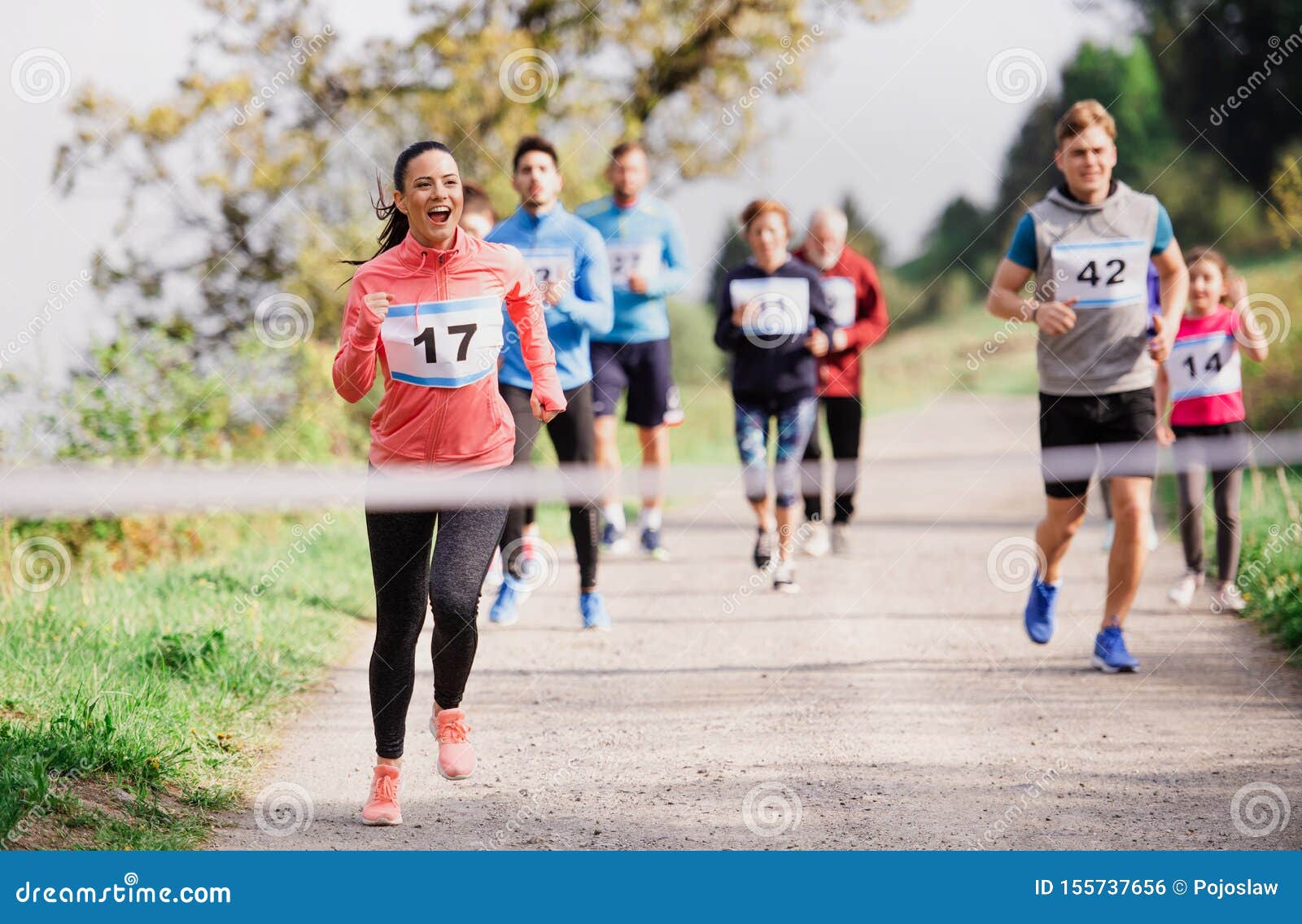 Large Group of Multi Generation People Running a Race Competition in ...
