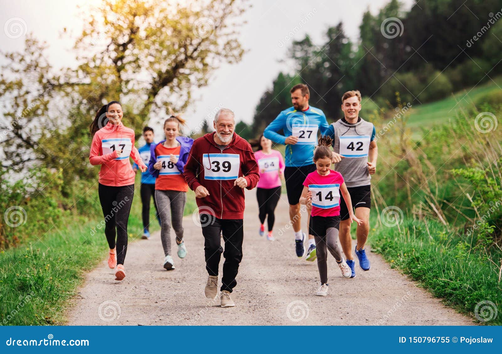 Large Group of Multi Generation People Running a Race Competition in ...