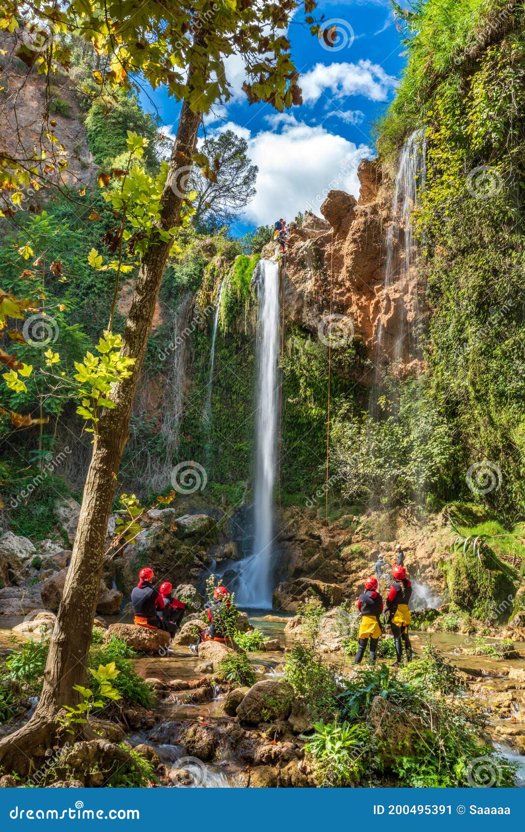 Large Group of People Enjoy Waterfall Descent Using Ropes Editorial ...